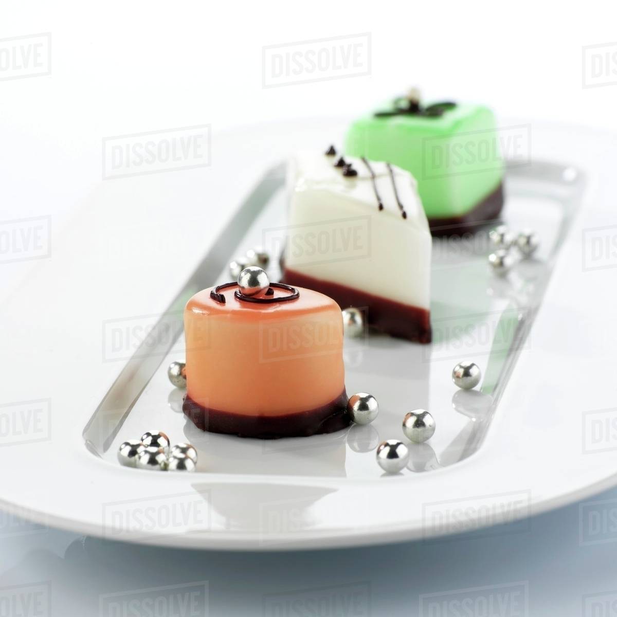 Three different petit fours with silver pearls - Royalty-free Stock ...