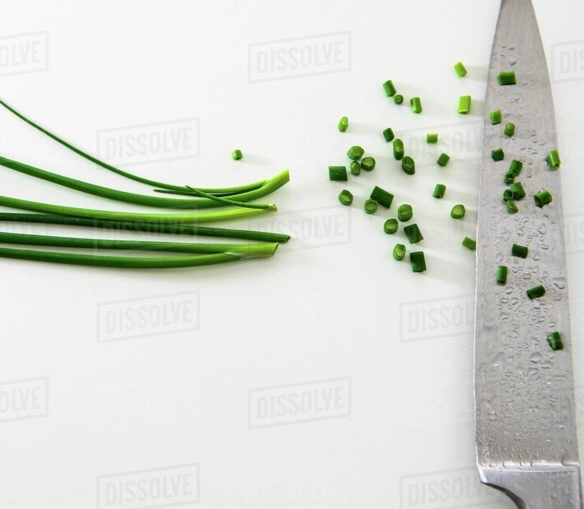Chopped chives on a knife - Stock Photo - Dissolve