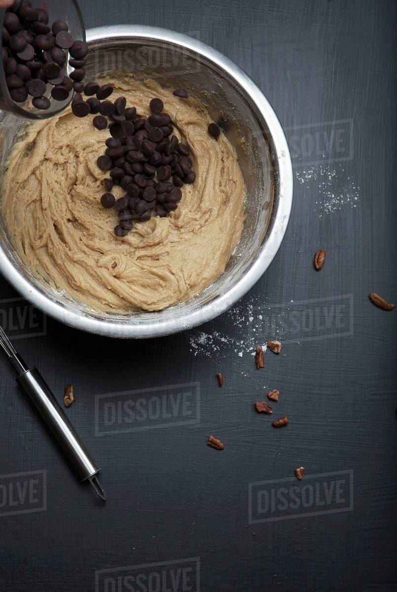 Chocolate Chip Cookie Dough in a Mixing Bowl with Wooden Spoon - Royalty-free Stock Photo | Dissolve