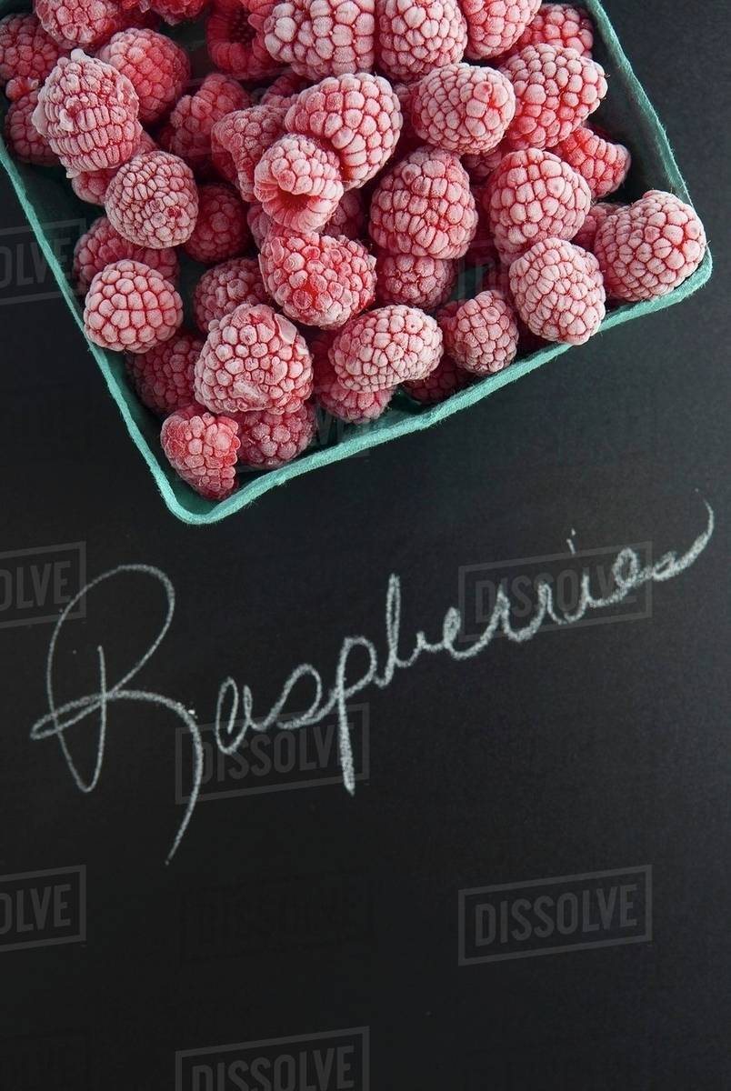 Frozen raspberries with a label - Royalty-free Stock Photo | Dissolve