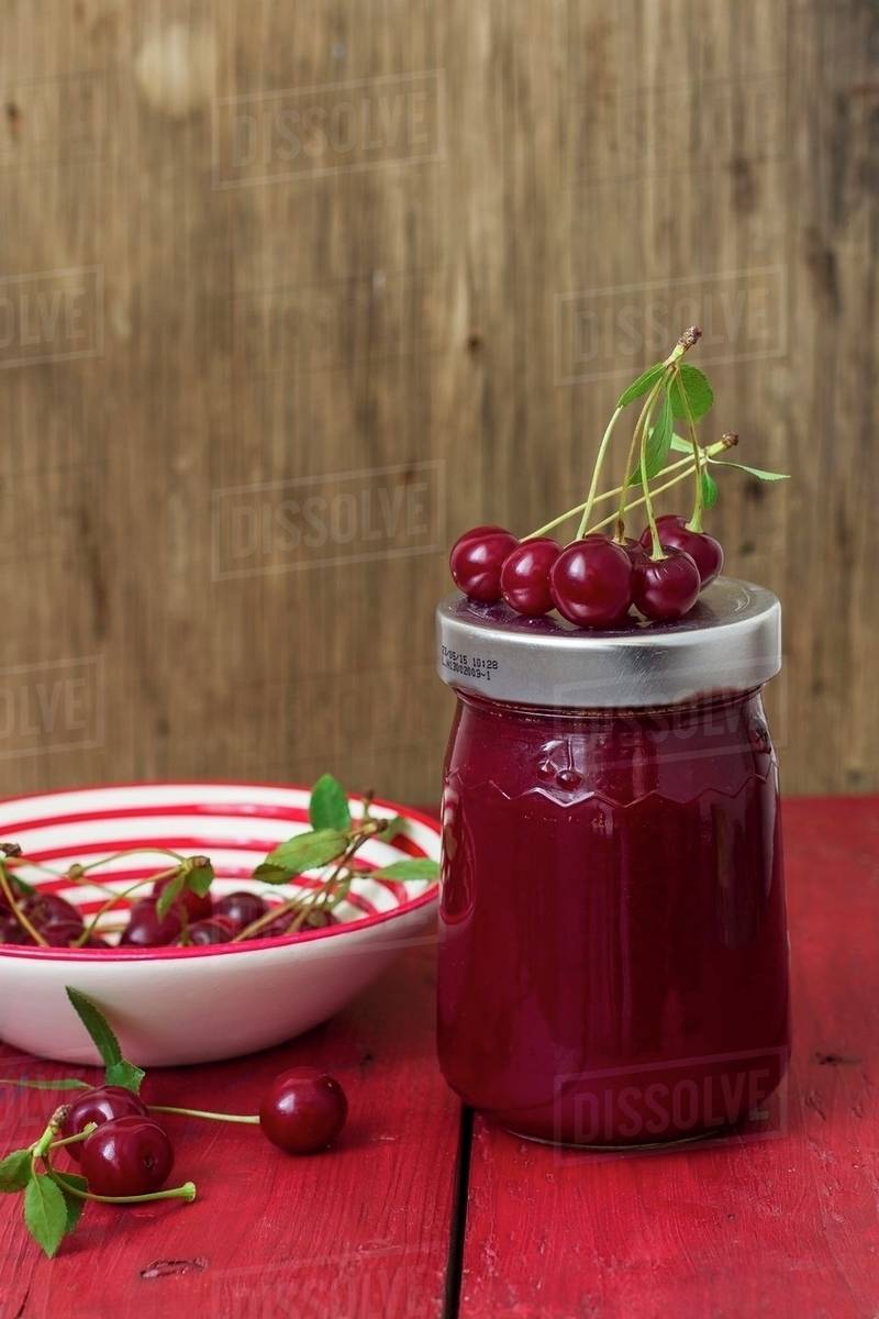 A jar of cherry jam and fresh cherries - Royalty-free Stock Photo ...