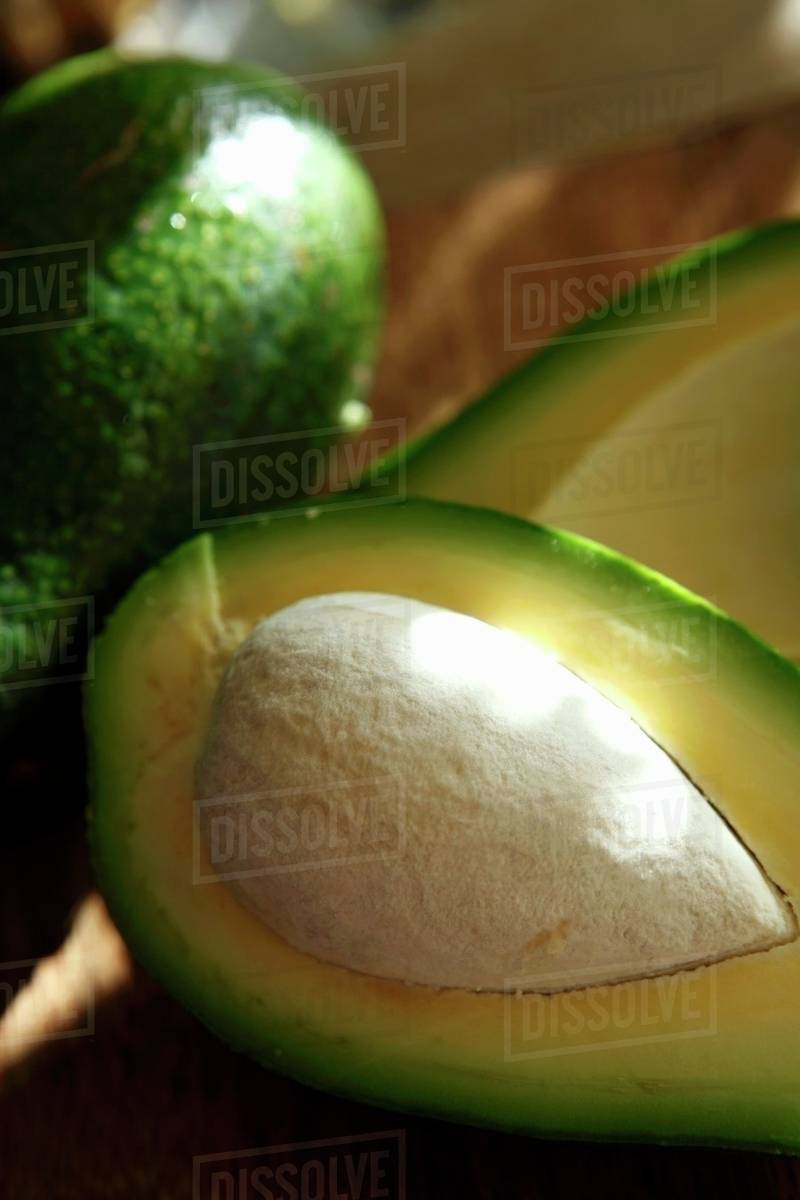 Avocado with pit (close up) - Royalty-free Stock Photo | Dissolve