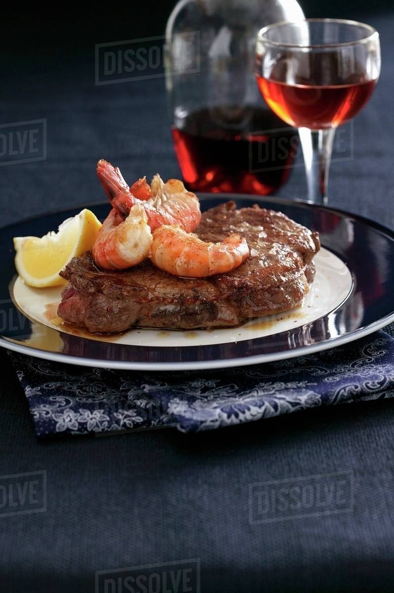 Beef steak with prawns - Royalty-free Stock Photo | Dissolve