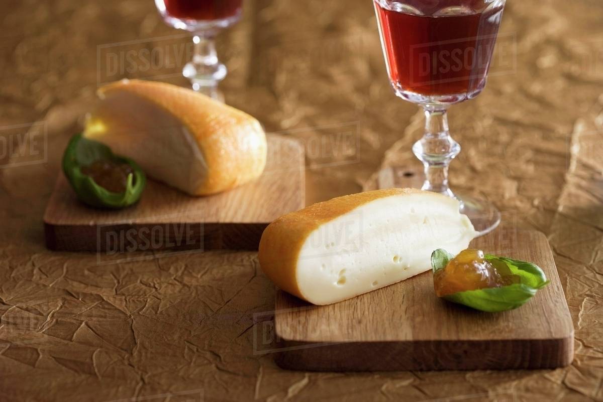 Chaumes cheese with fig jam and red wine - Stock Photo - Dissolve