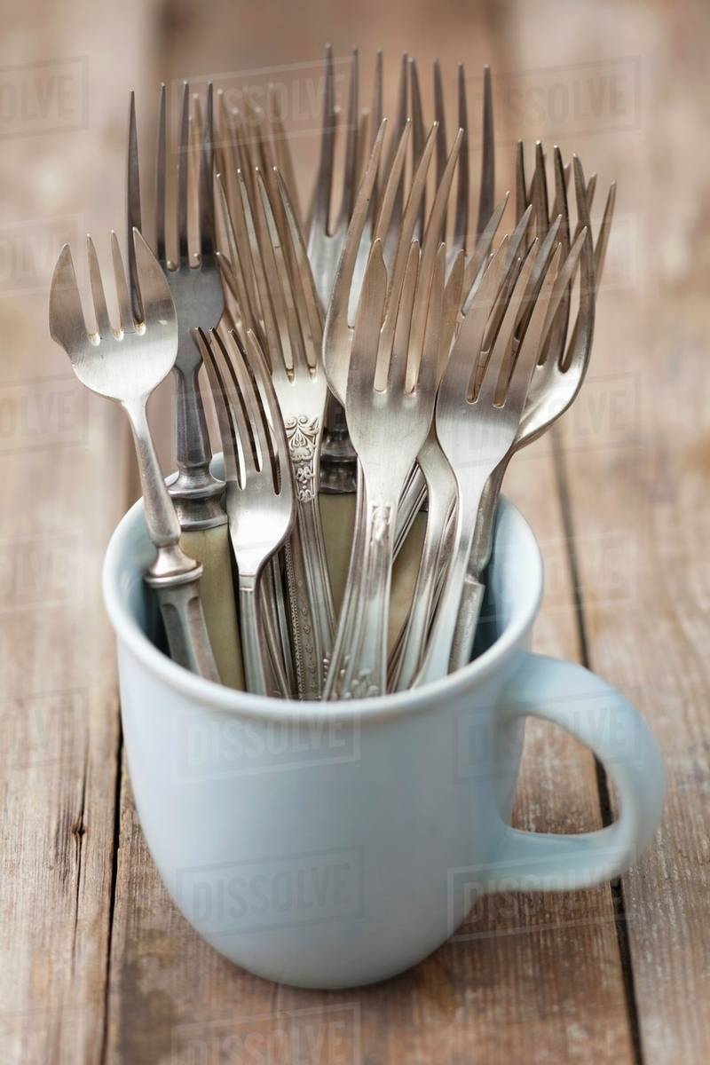 Old forks in a cup - Royalty-free Stock Photo | Dissolve