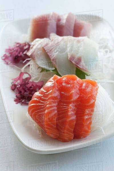 Sashimi on strips of radish with seaweed - Royalty-free Stock Photo ...