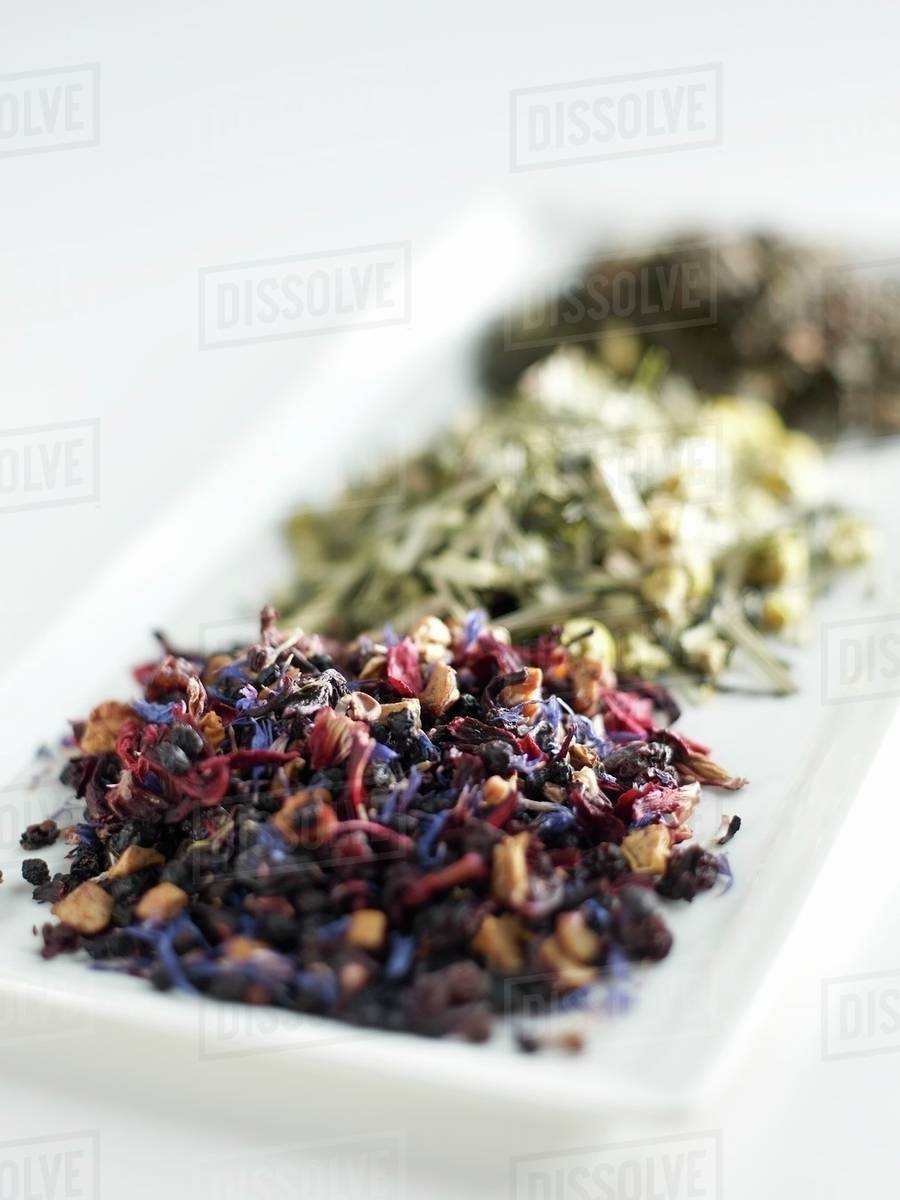 Various dried tea leaves on a tray - Stock Photo - Dissolve