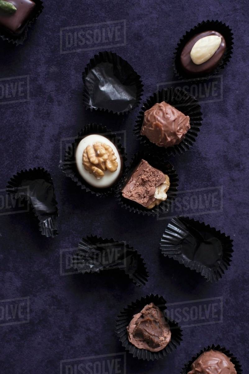 An assortment of filled chocolates and empty chocolate cases - Royalty ...