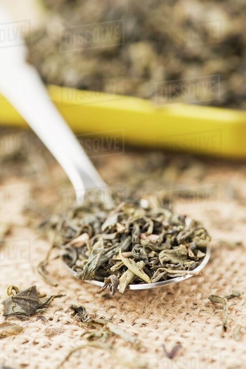 Green tea on a spoon - Royalty-free Stock Photo | Dissolve