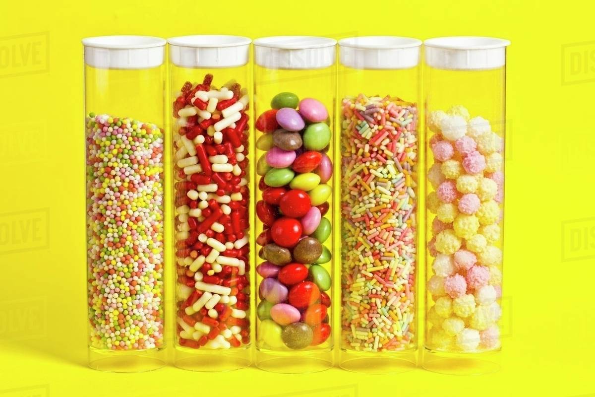 Colourful sugar decorations in sealable plastic tubes - Royalty-free ...