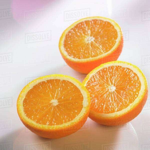 Three Orange Halves - Royalty-free Stock Photo | Dissolve