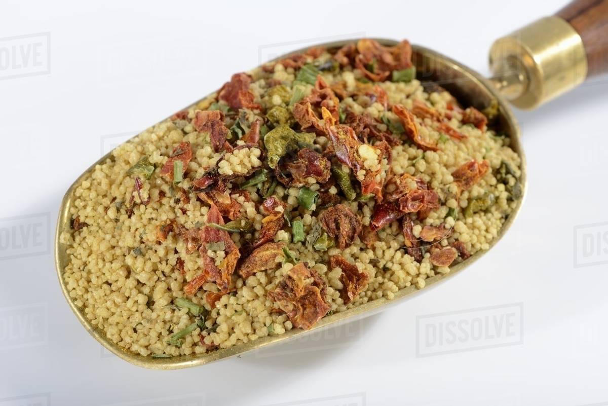A ready-made mix of couscous with dried vegetables and spices - Stock ...