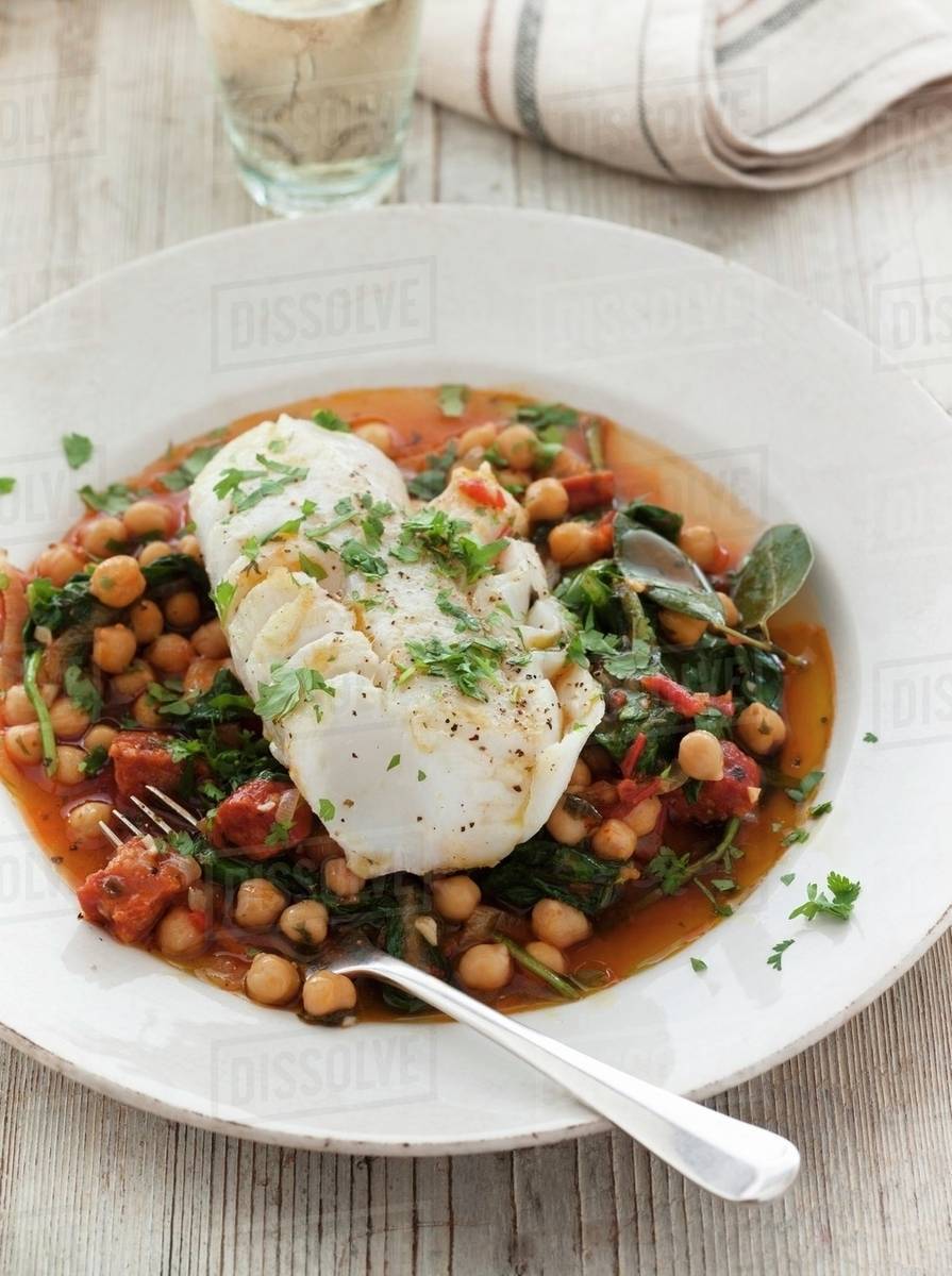 White fish with chickpeas and chourico - Royalty-free Stock Photo ...