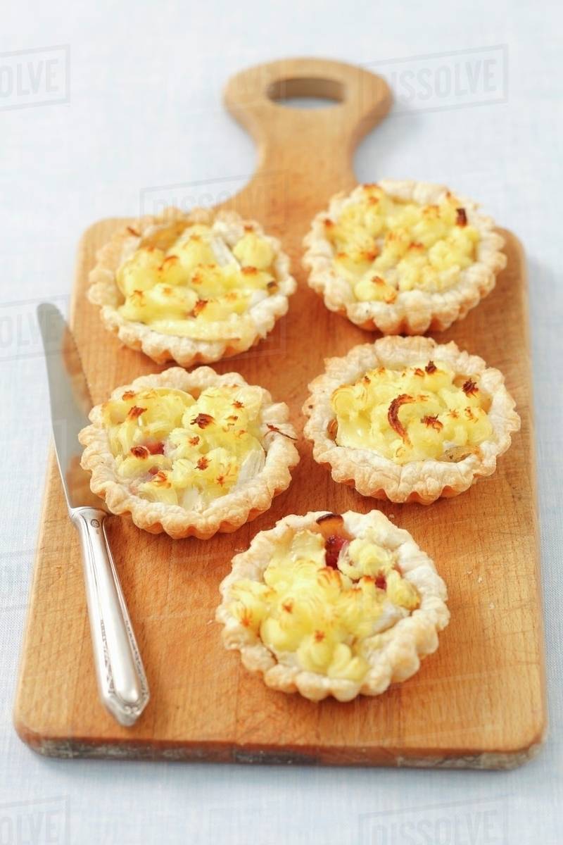 Puff pastry tartlets with camembert and potato mash - Royalty-free ...