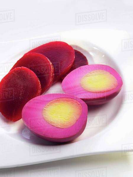 Sliced Beets and a Hard Boiled Egg Boiled in Beet Juice - Stock Photo ...