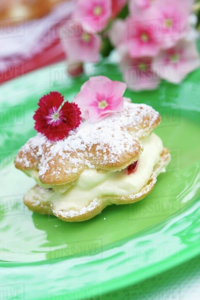 Choux pastry filled with creme patissiere and topped with edible ...