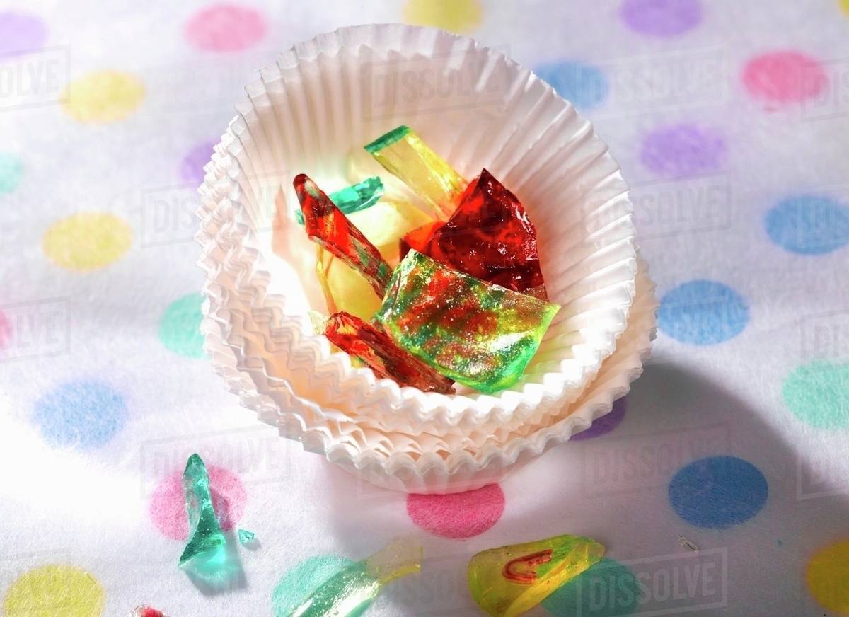 Coloured sweets in a stack of paper cases - Royalty-free Stock Photo ...