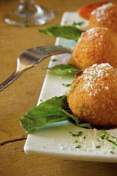 Deep Fried Risotto Balls on a Platter with Parmesan Cheese - Royalty ...