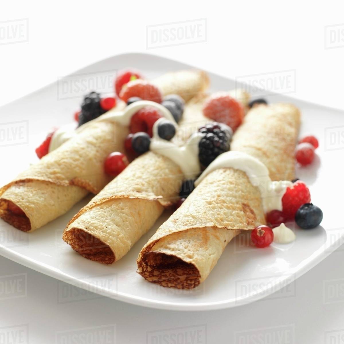 Pancake rolls with fresh berries - Royalty-free Stock Photo | Dissolve