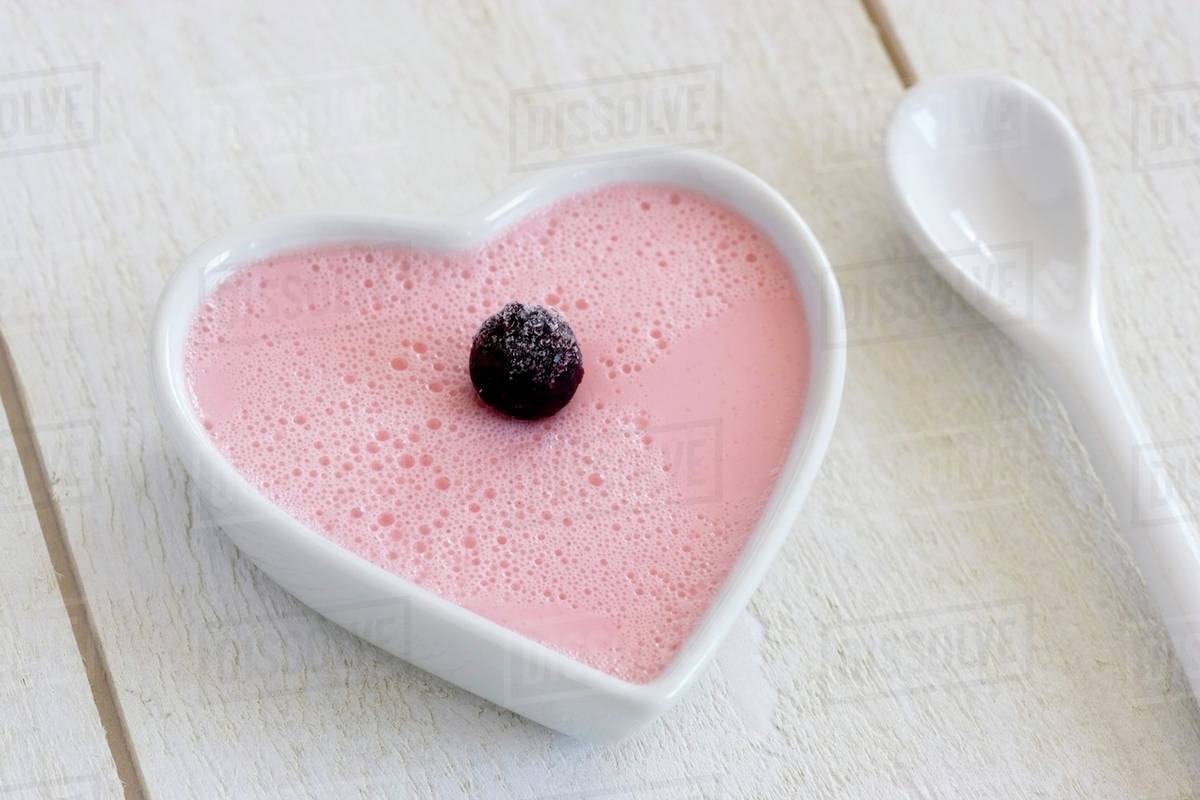 Raspberry flan in a heart-shaped dish - Royalty-free Stock Photo | Dissolve
