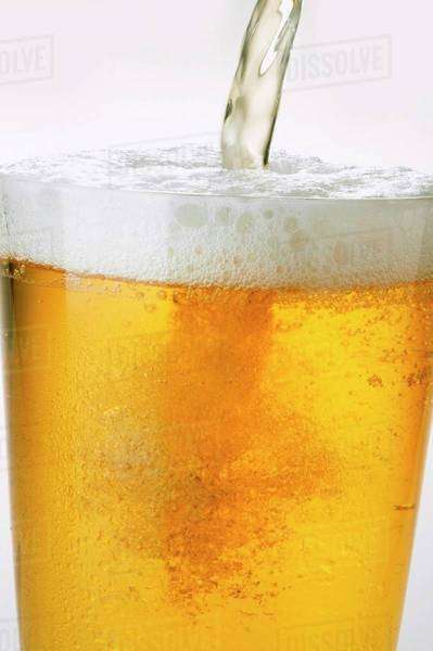 Pouring lager - Royalty-free Stock Photo | Dissolve
