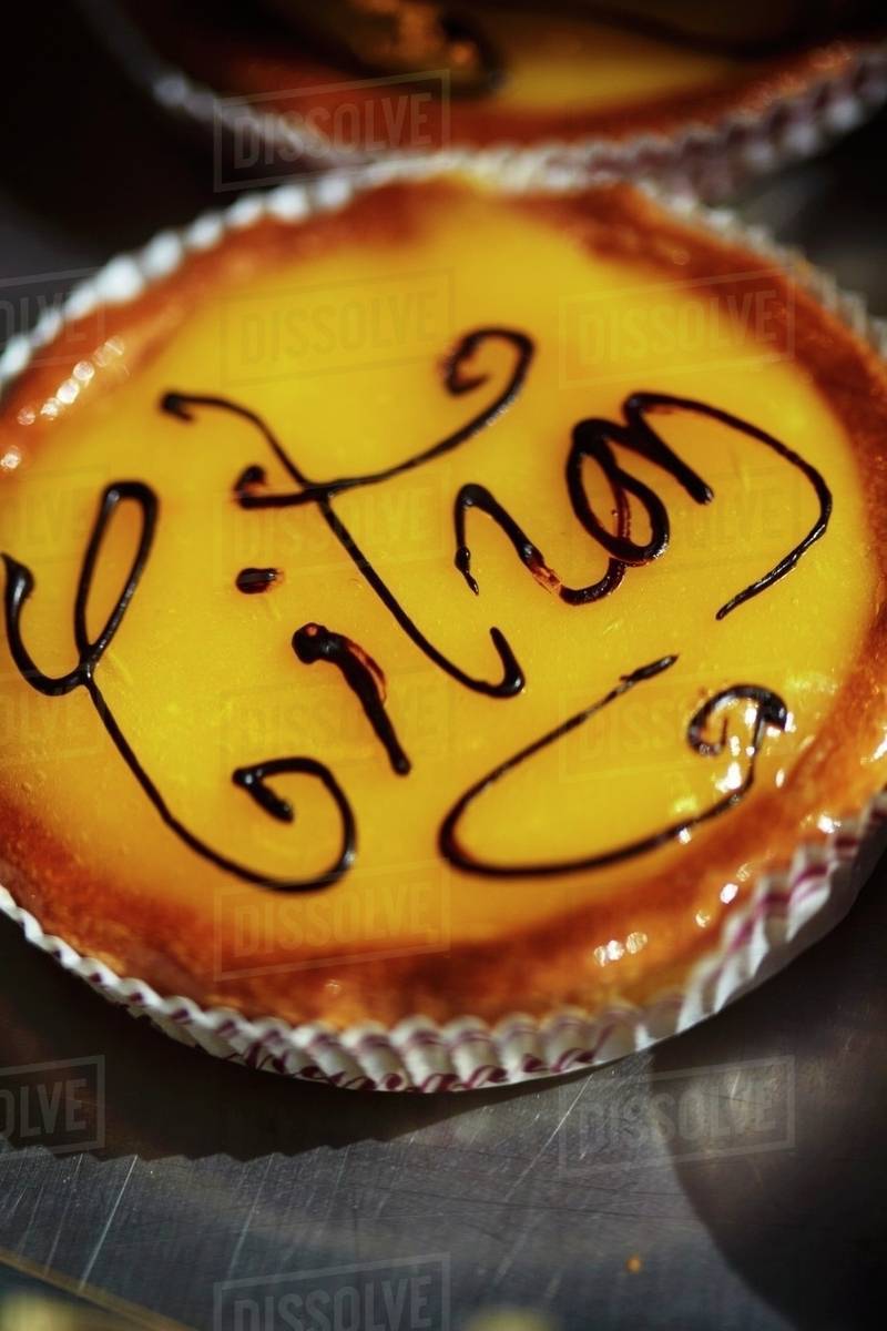 A lemon tart with writing - Royalty-free Stock Photo | Dissolve