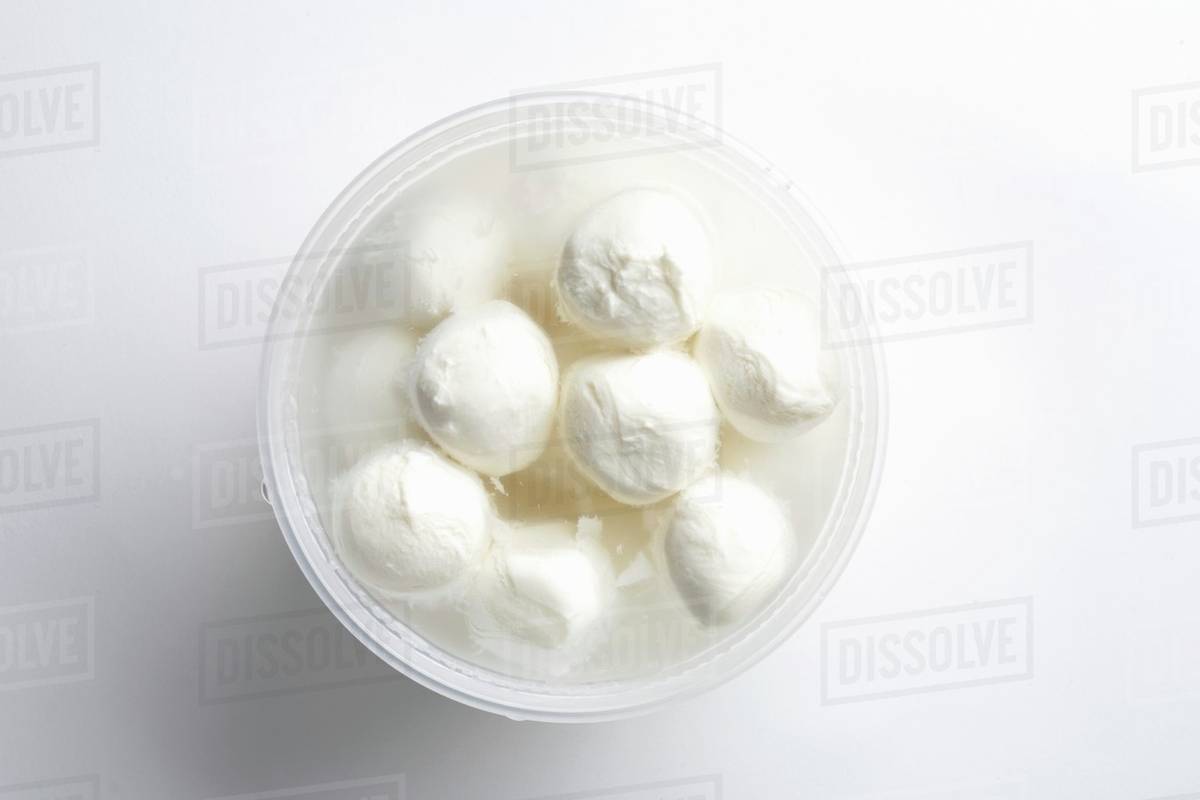 Fresh Buffalo Mozzarella in a Plastic Container - Stock Photo - Dissolve