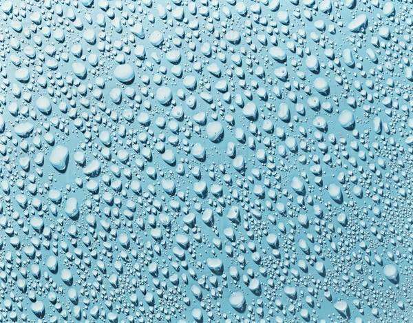 Water droplets on a blue surface - Royalty-free Stock Photo | Dissolve
