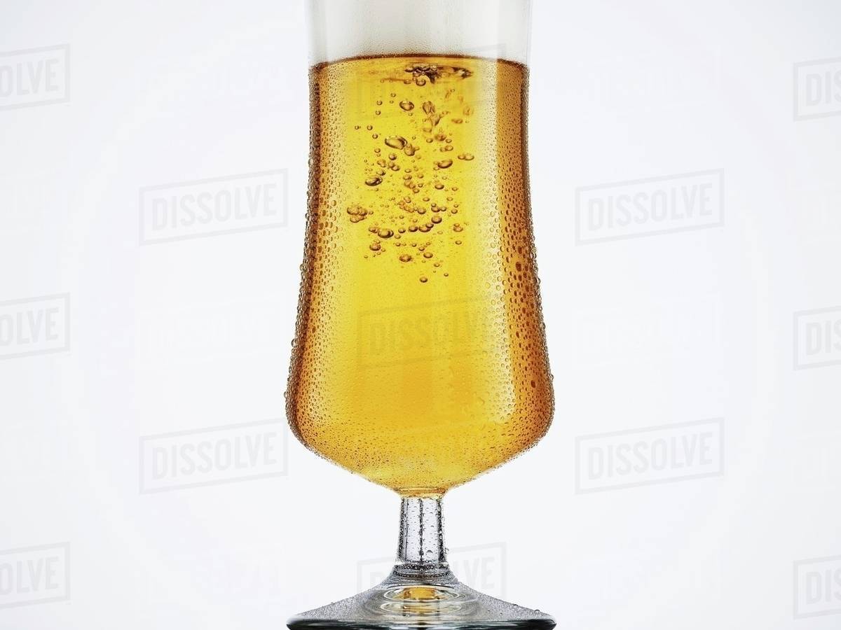 A glass of sparkling beer - Royalty-free Stock Photo | Dissolve
