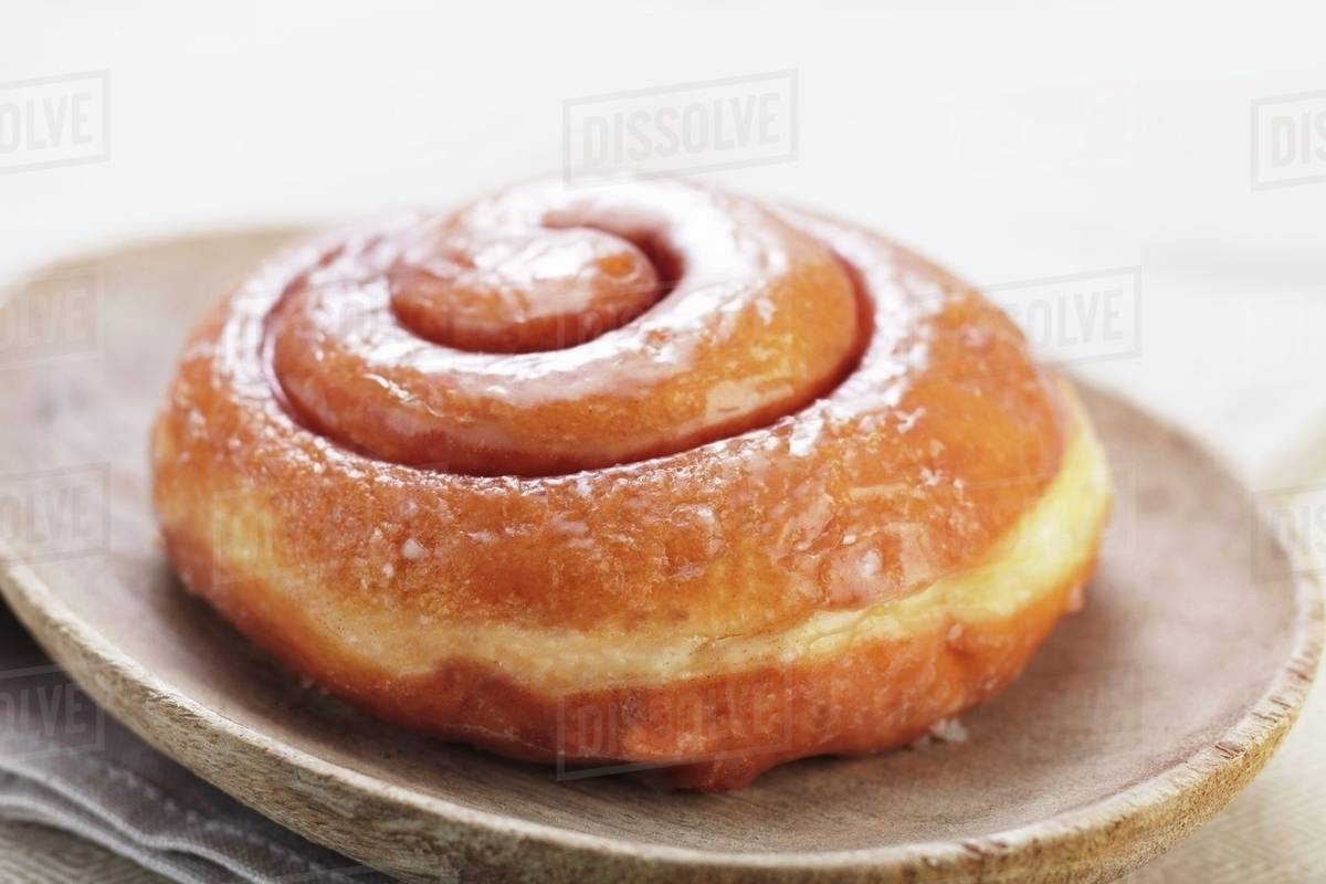 Glazed Cinnamon Roll Doughnut - Royalty-free Stock Photo | Dissolve