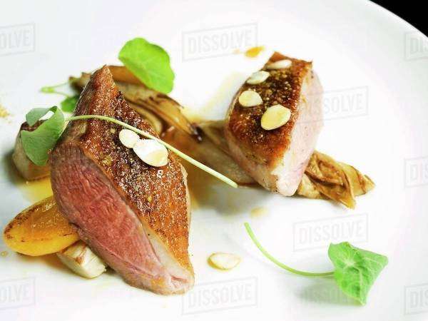 Fried duck breast with apricot sauce and slivered almonds - Royalty ...