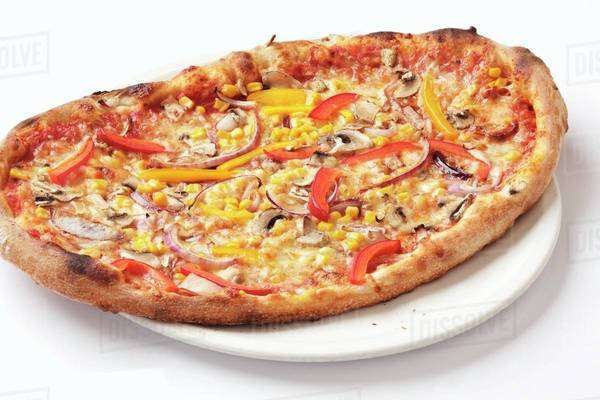 Pepper, sweetcorn and onion pizza - Stock Photo - Dissolve