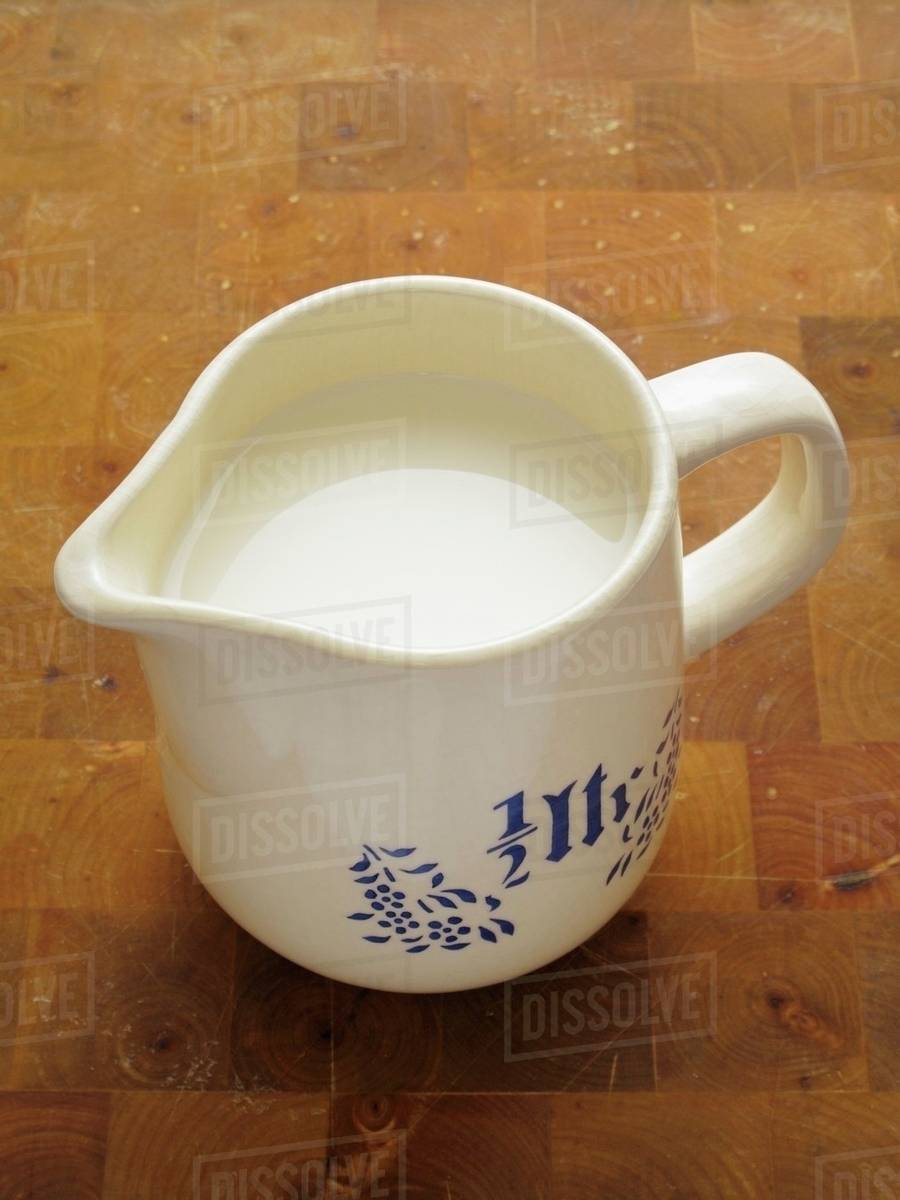 Small jug of milk - Royalty-free Stock Photo | Dissolve