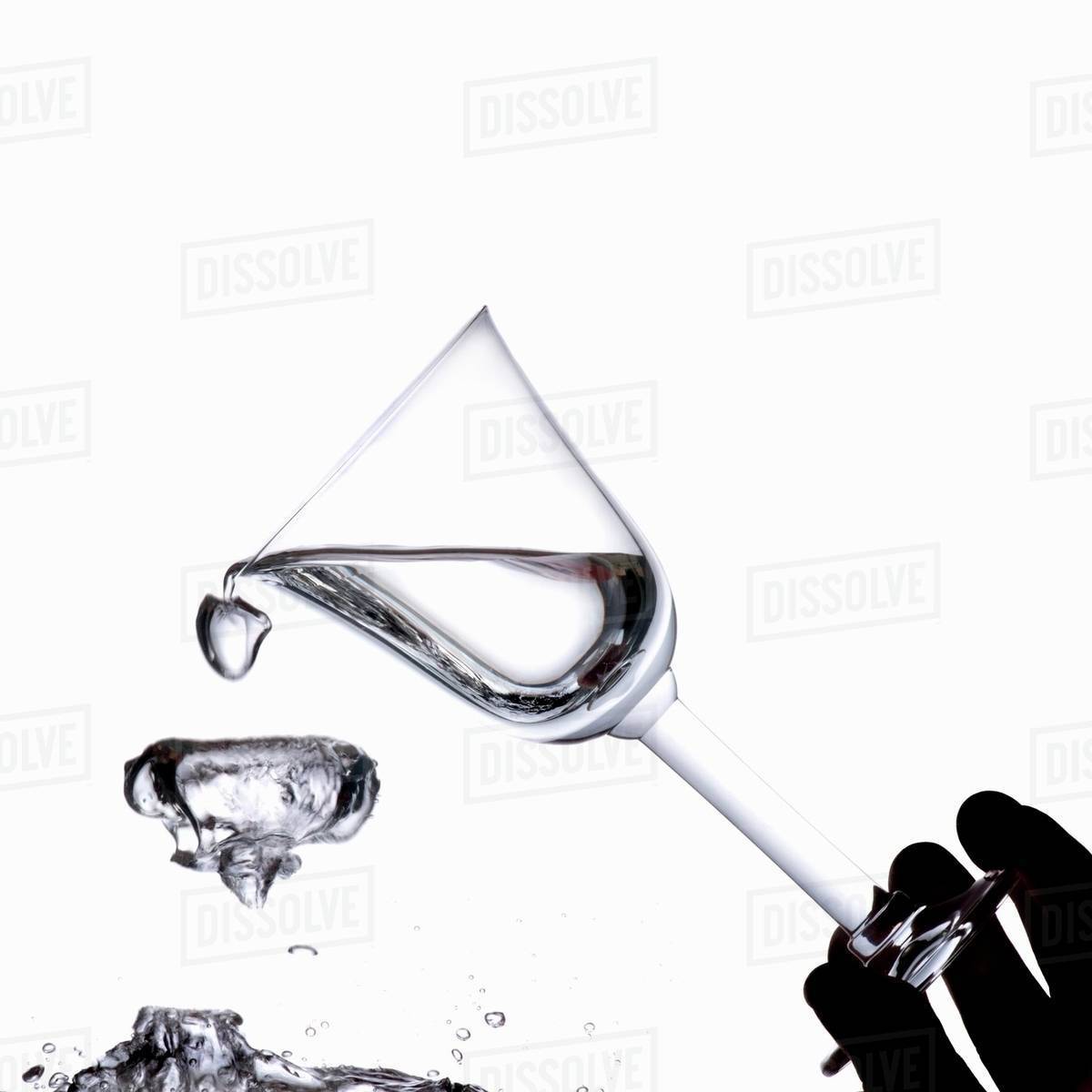 Shaking water out of a water glass - Royalty-free Stock Photo | Dissolve