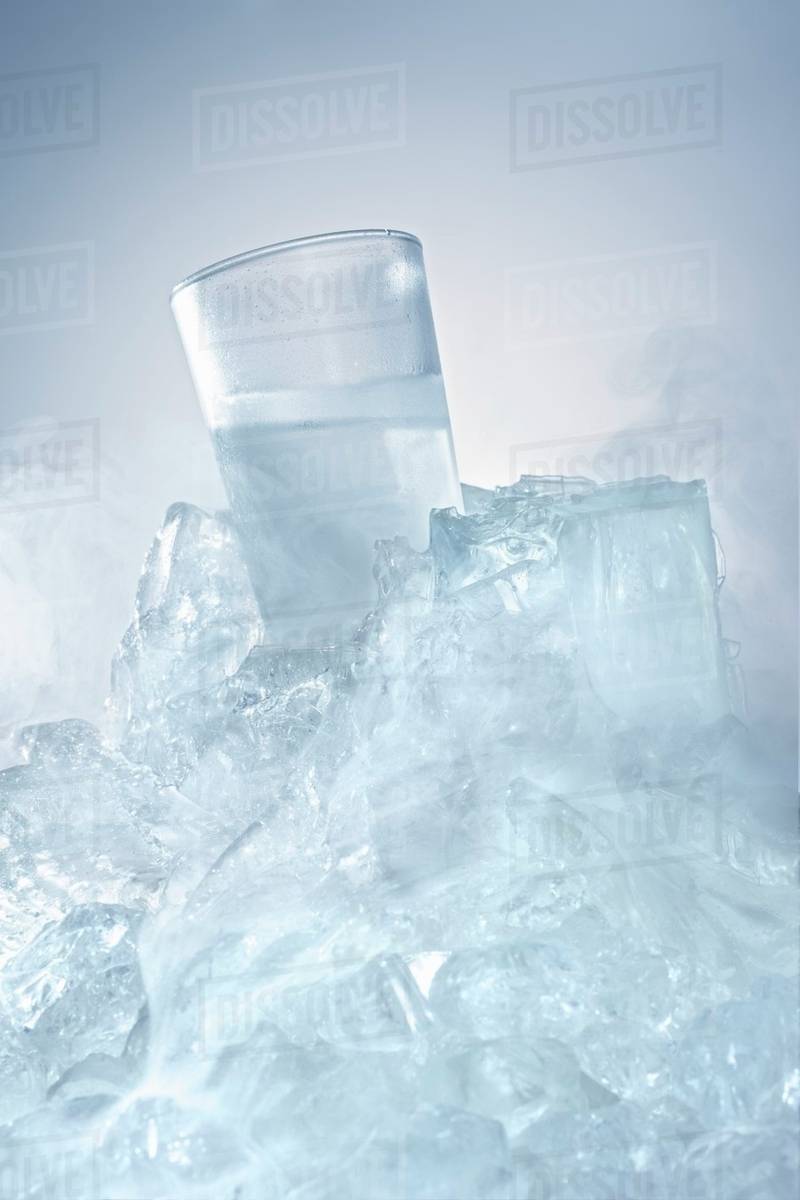 Vodka glass in a block of ice - Stock Photo - Dissolve