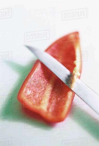 Deseeding a red pepper - Royalty-free Stock Photo | Dissolve