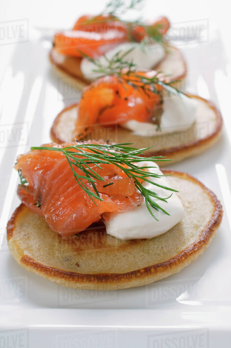 Blinis with smoked salmon and sour cream - Stock Photo - Dissolve