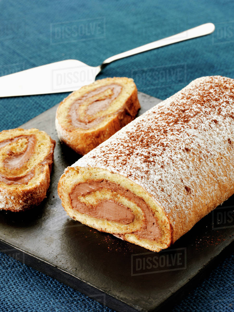 Sponge roll with chocolate cream - Stock Photo - Dissolve