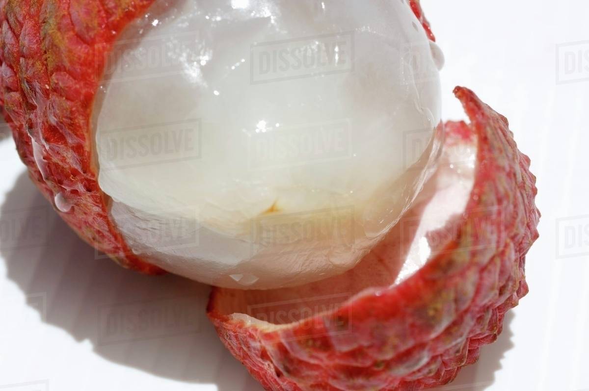 A half-peeled lychee - Royalty-free Stock Photo | Dissolve