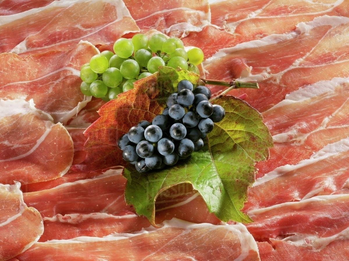 Grapes on sliced Parma ham - Royalty-free Stock Photo | Dissolve