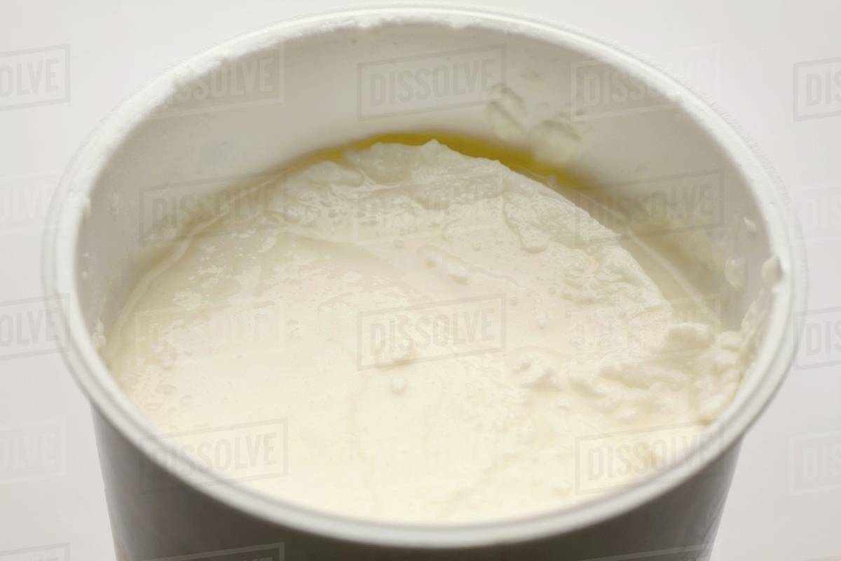Sheep's milk yoghurt in an open pot - Royalty-free Stock Photo | Dissolve
