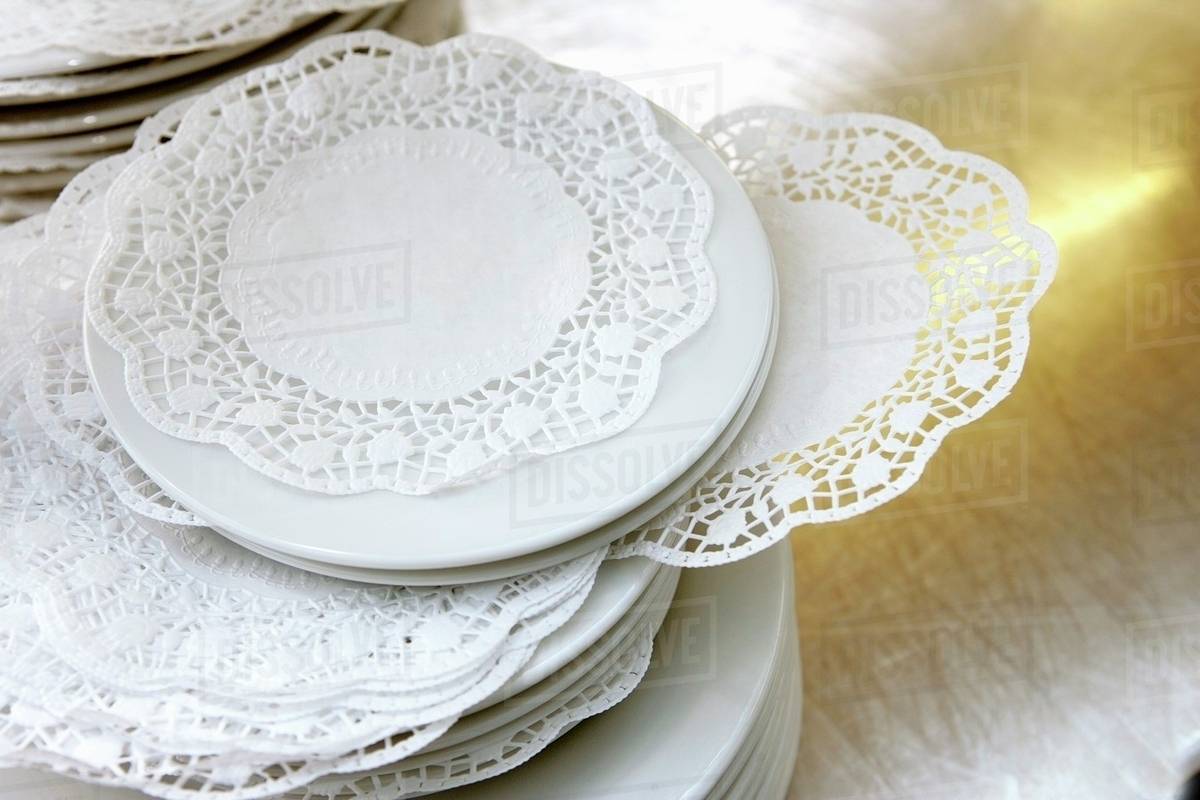 Tea plates with doileys - Stock Photo - Dissolve