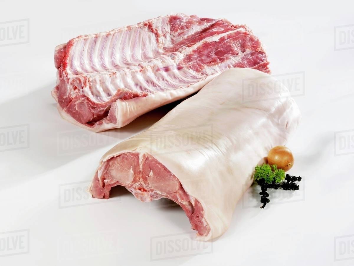 Two raw saddles of suckling pig - Stock Photo - Dissolve