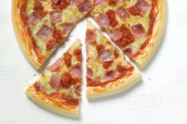Ham, cheese and tomato pizza (partly sliced) - Royalty-free Stock Photo ...