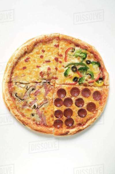 US-style ham, pepperoni and vegetable pizza in quarters - Stock Photo ...