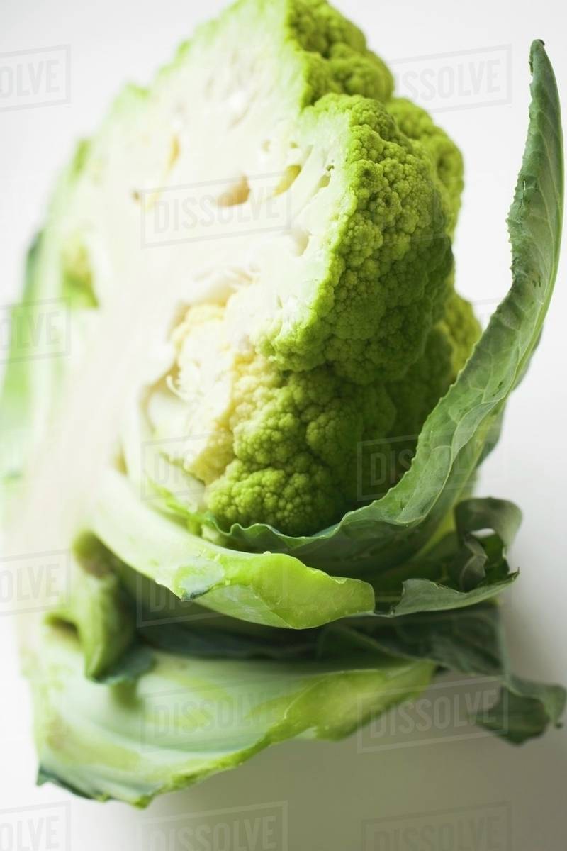 Green cauliflower, halved - Royalty-free Stock Photo | Dissolve