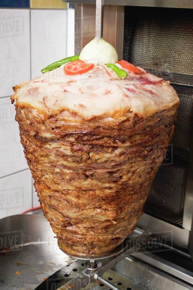 Doner kebab on spit in the kitchen of a snack bar - Royalty-free Stock ...