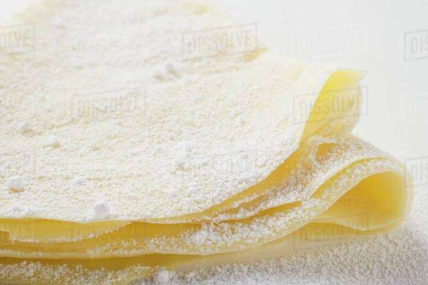 Folded crepe with icing sugar - Royalty-free Stock Photo | Dissolve
