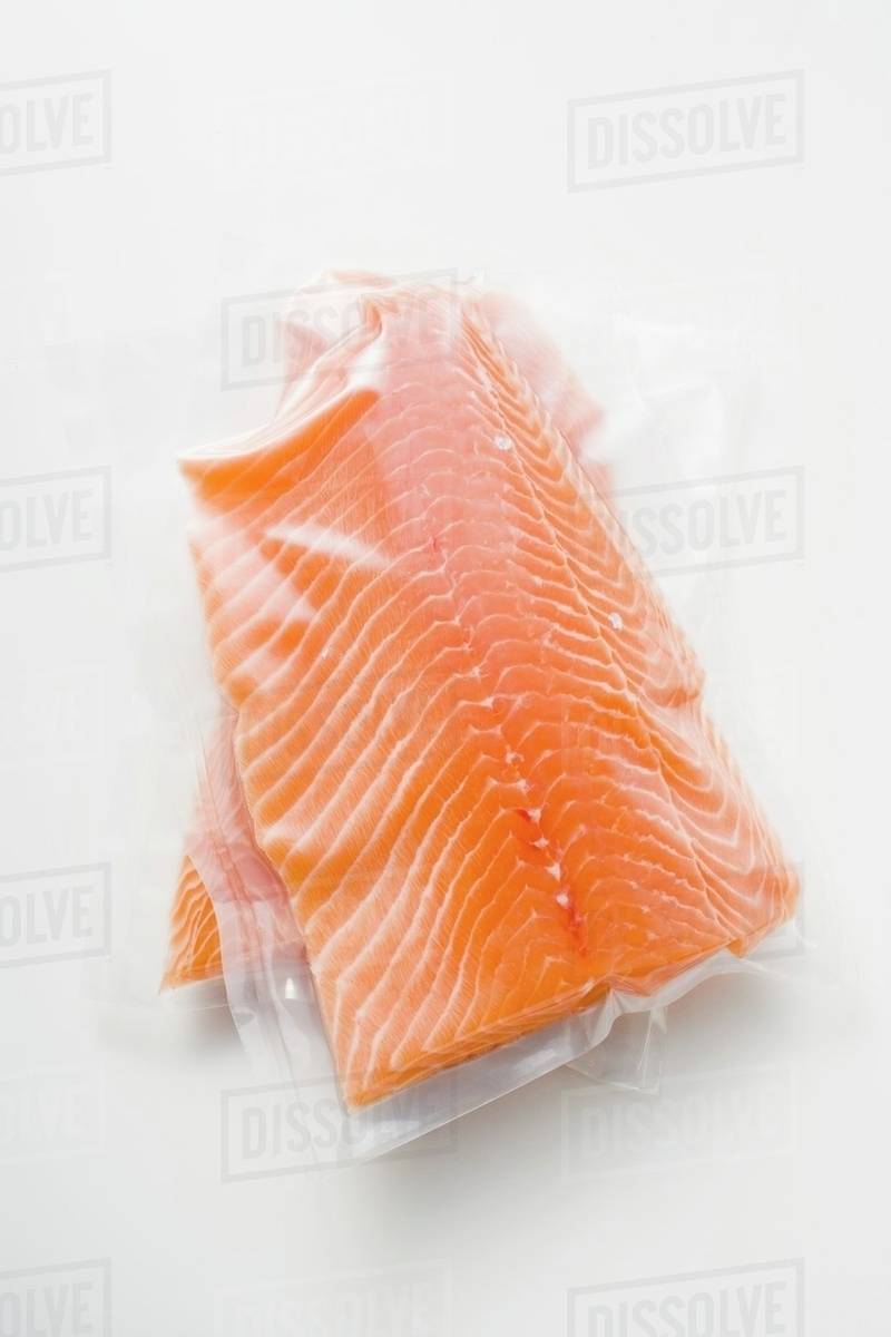 Salmon fillet in plastic packaging - Stock Photo - Dissolve
