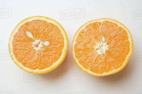 Two orange halves - Royalty-free Stock Photo | Dissolve